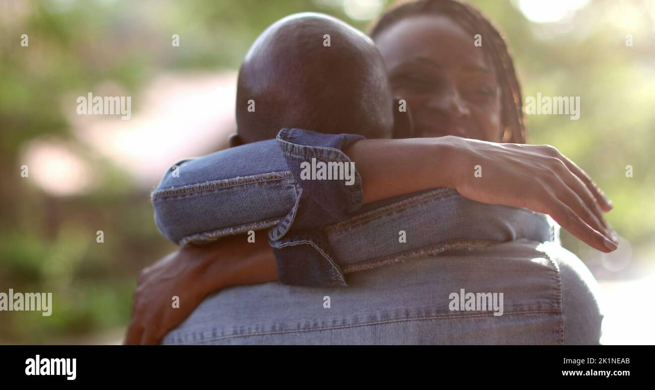 African people hugging, woman running towards partner hugs and embrace ...