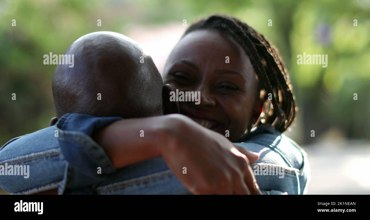 African people hugging, woman running towards partner hugs and embrace ...