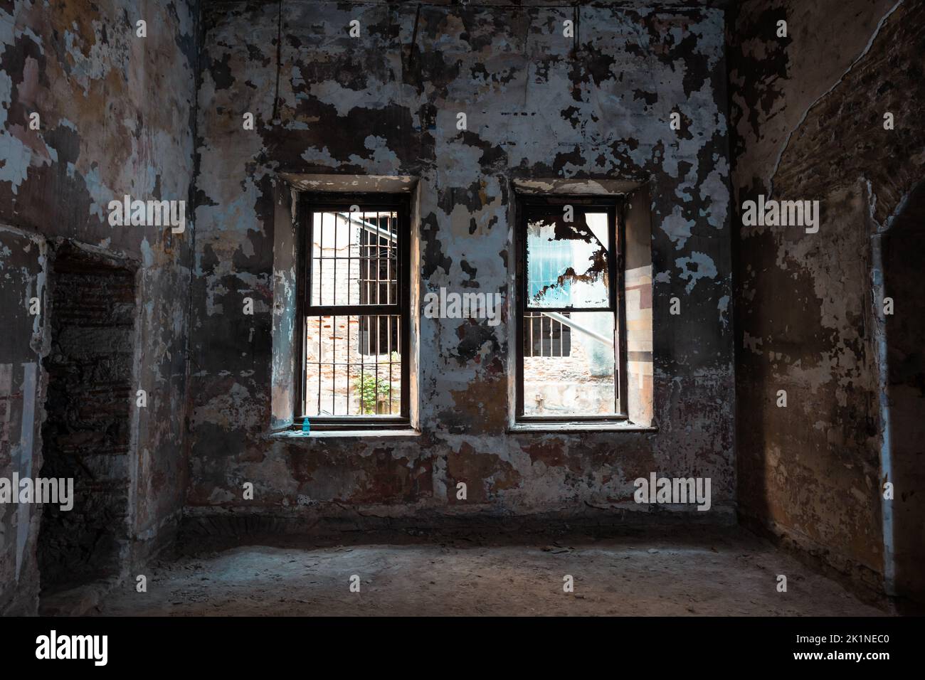 Abandoned building. Broken windows and peeled walls of an historical ...