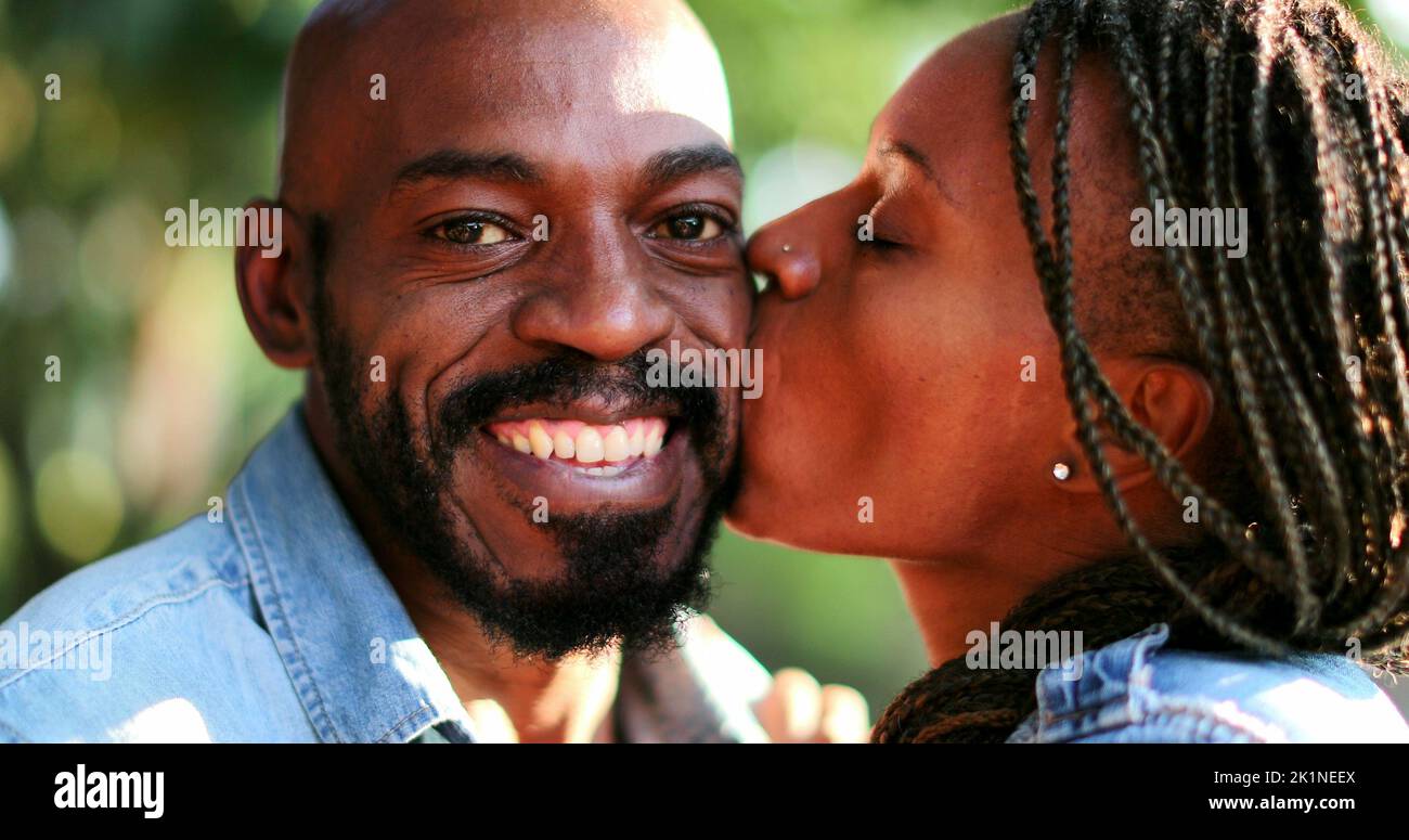 Black man kissing wife outside hi-res stock photography and images - Alamy