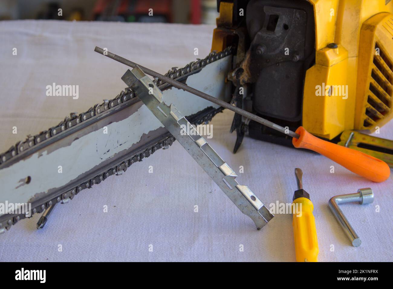 Image of a chainsaw with tools to sharpen the chain. Preparation of ...