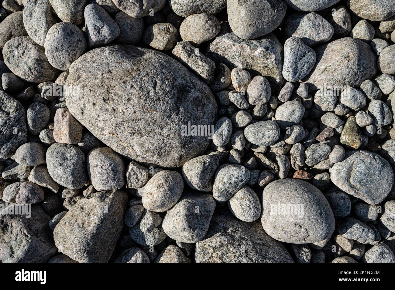 Round stones on a beach Stock Photo - Alamy