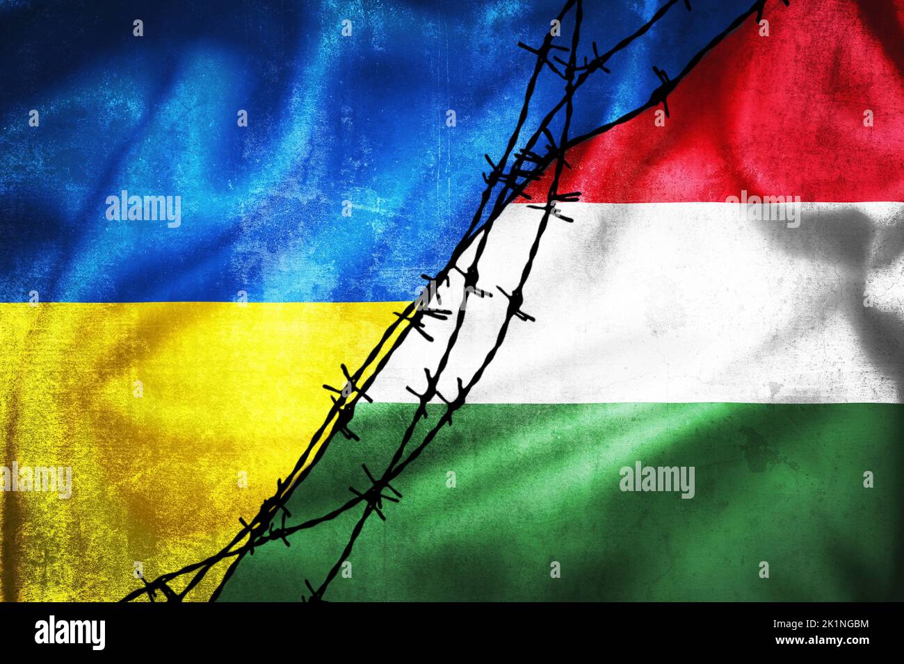 Grunge flags of Ukraine and Hungary divided by barb wire illustration ...