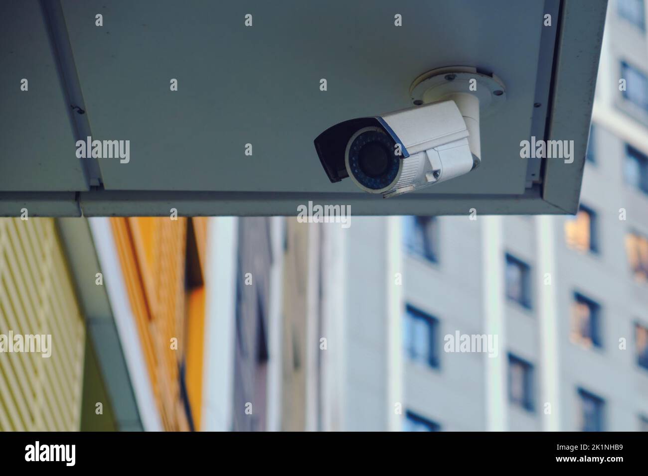 Outdoor surveillance security camera at the entrance of a residential ...