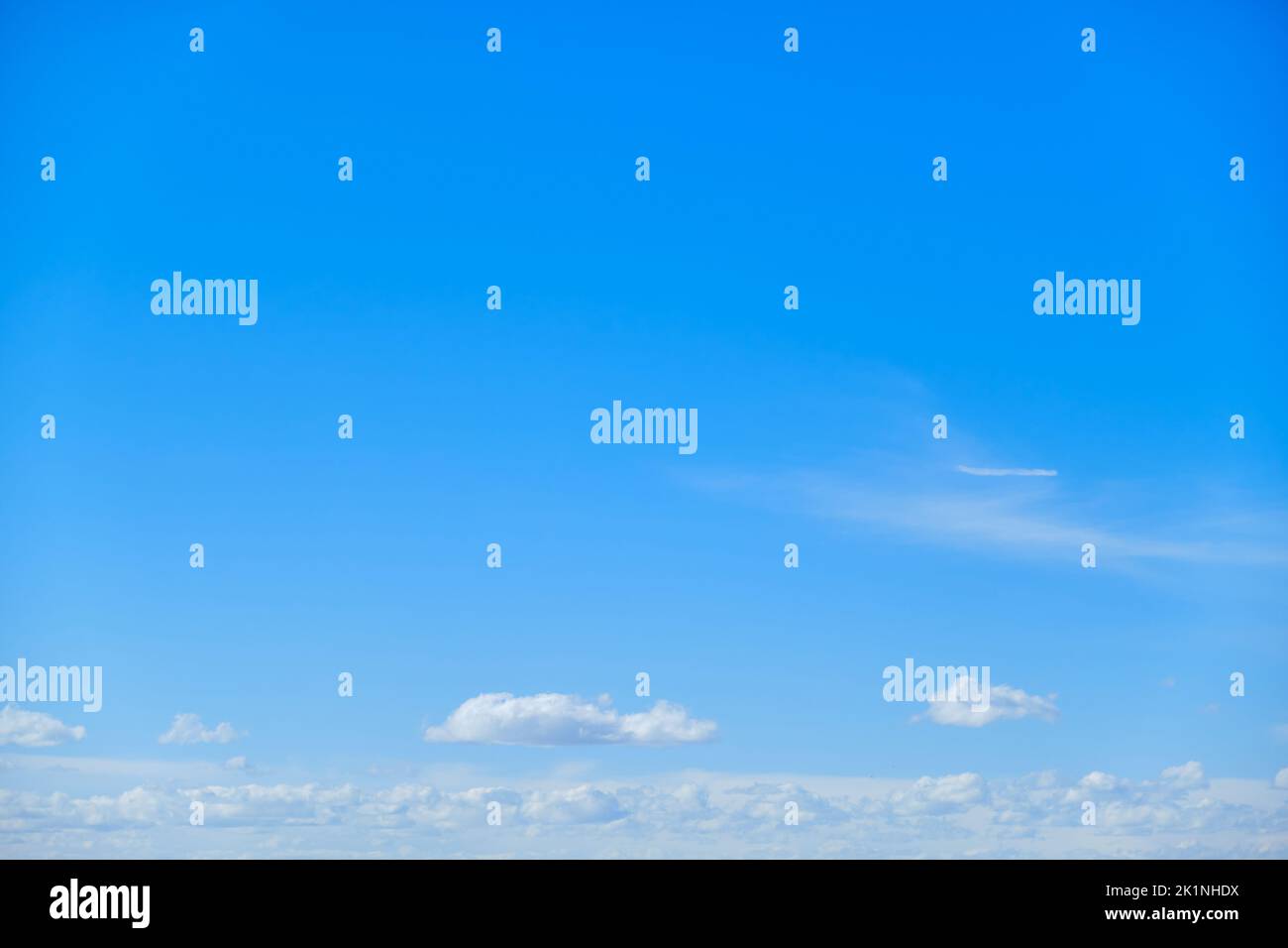 Blue sky with white cumulus clouds. Bright sunny day with cloudy sky ...