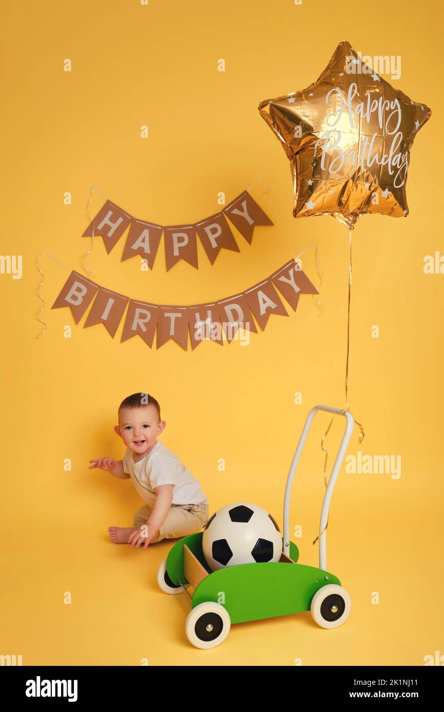 Decorations on a studio yellow background for celebrating the first ...