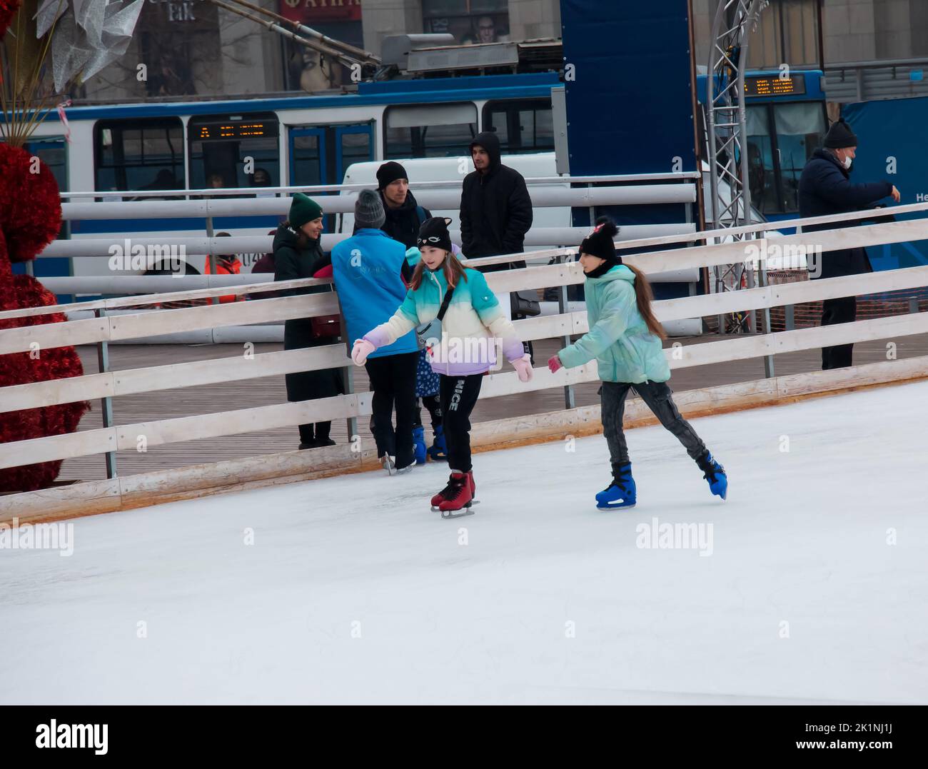 Dnipro, Ukraine - 02.10.2022: People have fun skating on a public ice ...