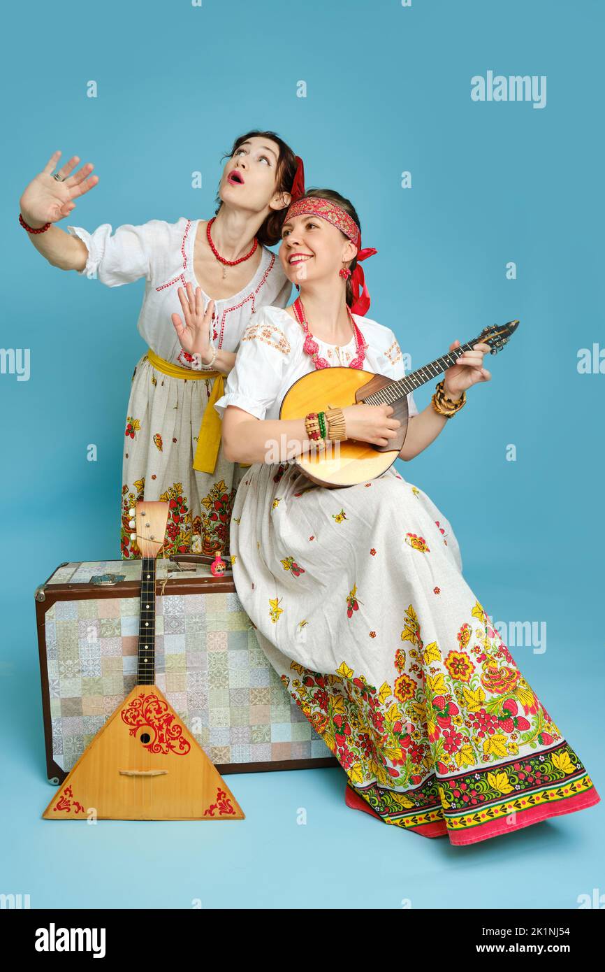 Women musicians in Russian folk dresses with musical instruments on a ...