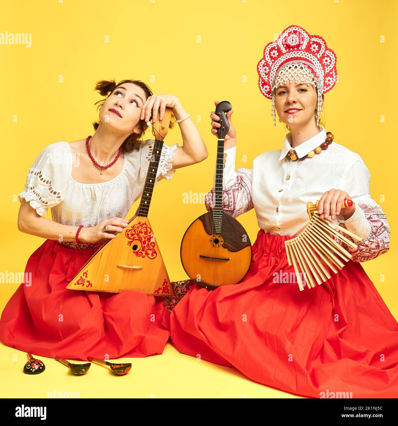 Women musicians in Russian folk dresses with musical instruments on a ...