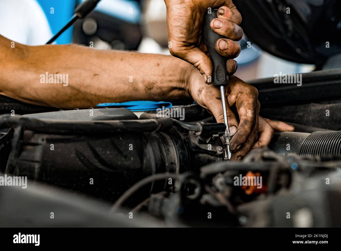 Close up of auto mechanic repairing car engine in car service Stock ...