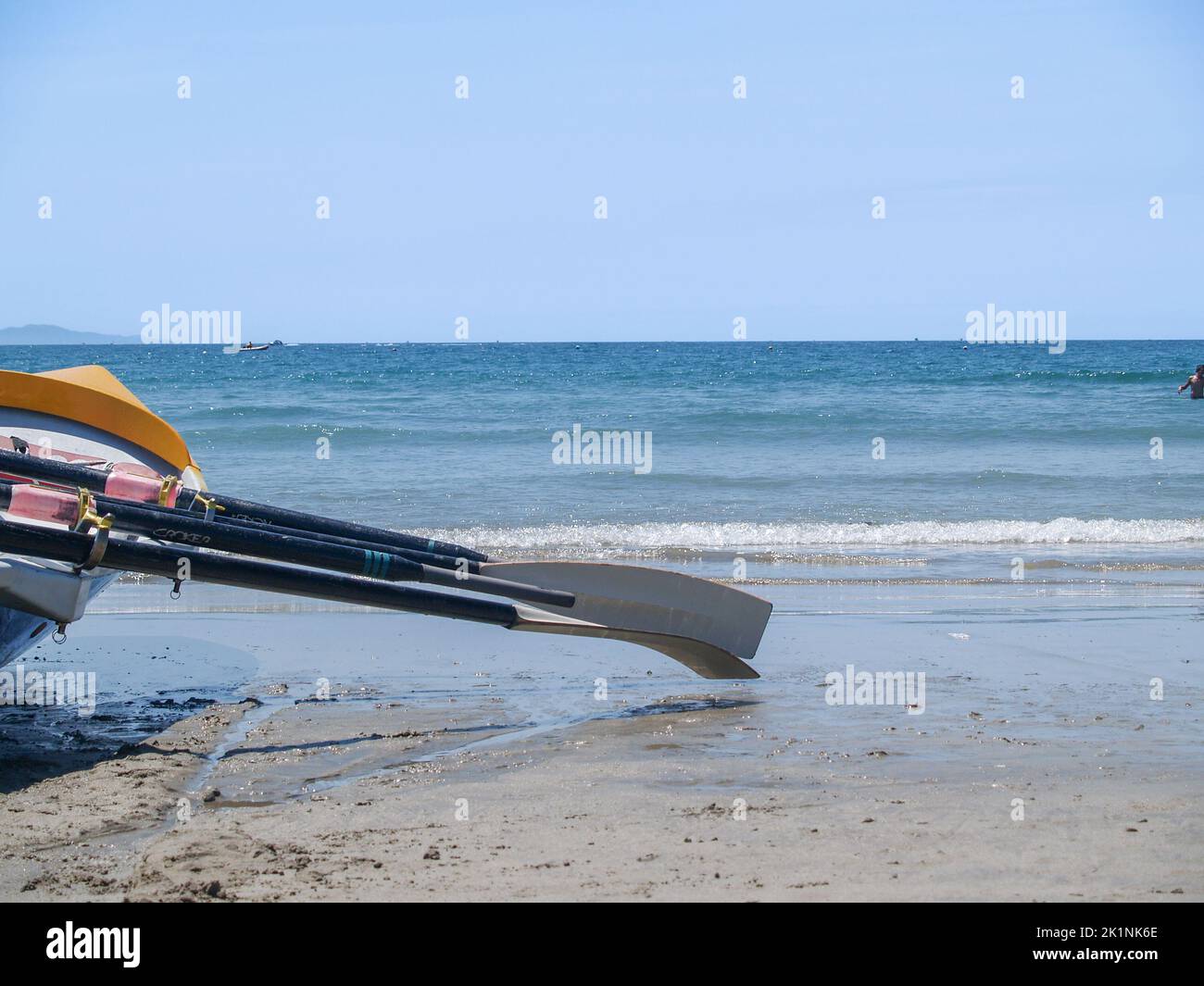 Surf-boat sitting at waters edge of ocean beach view to horizon Stock ...