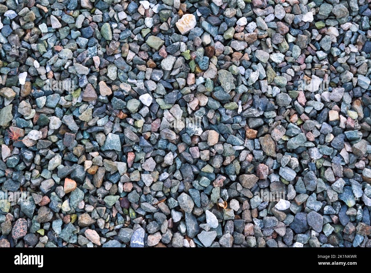 Crushed close up different stone texture background Stock Photo - Alamy