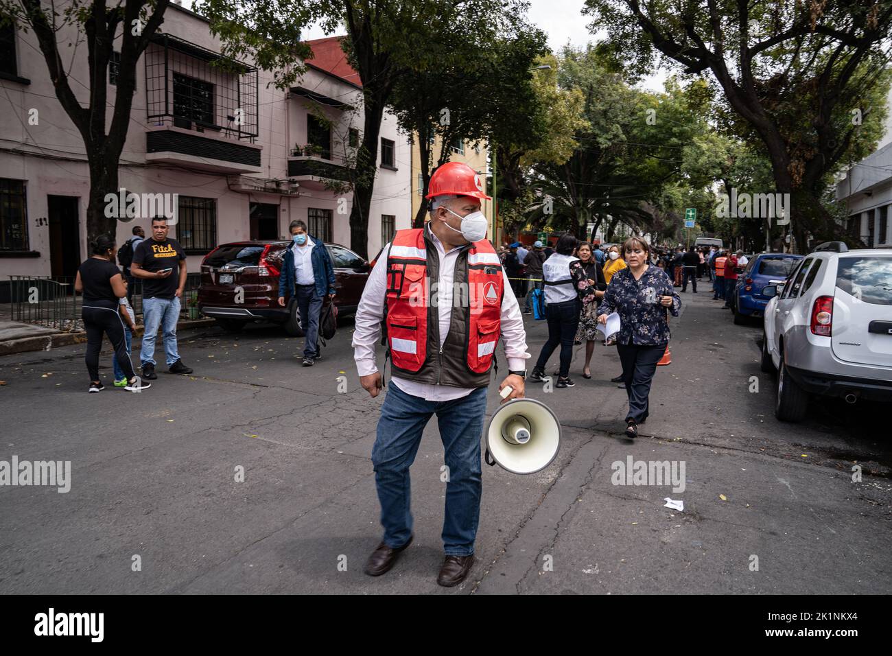 Mexico City, Mexico. 19th Sep, 2022. a man organizes first aid and evacuation procedure for ...