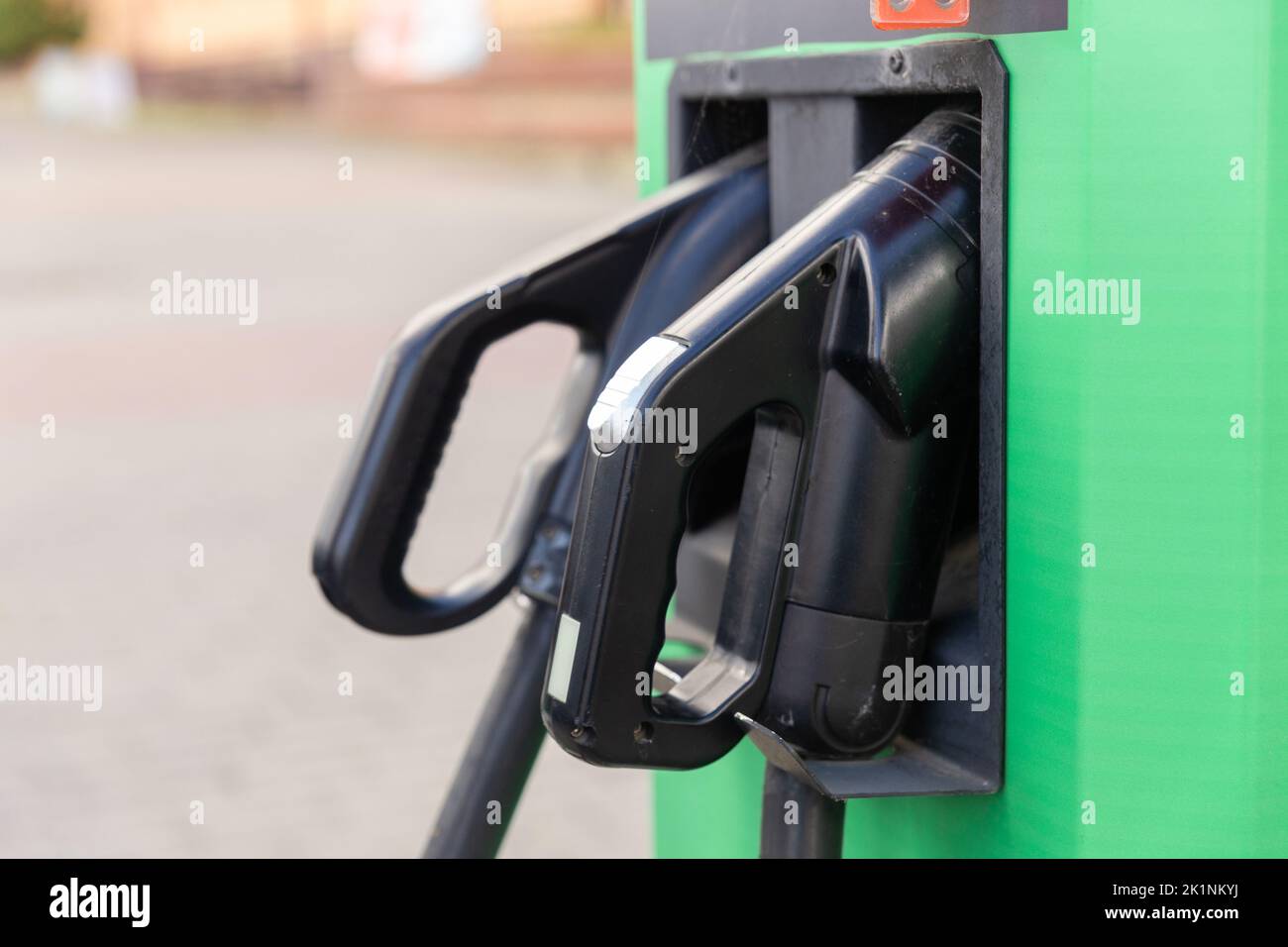 Charging station for electric vehicles with two types of cables for ...