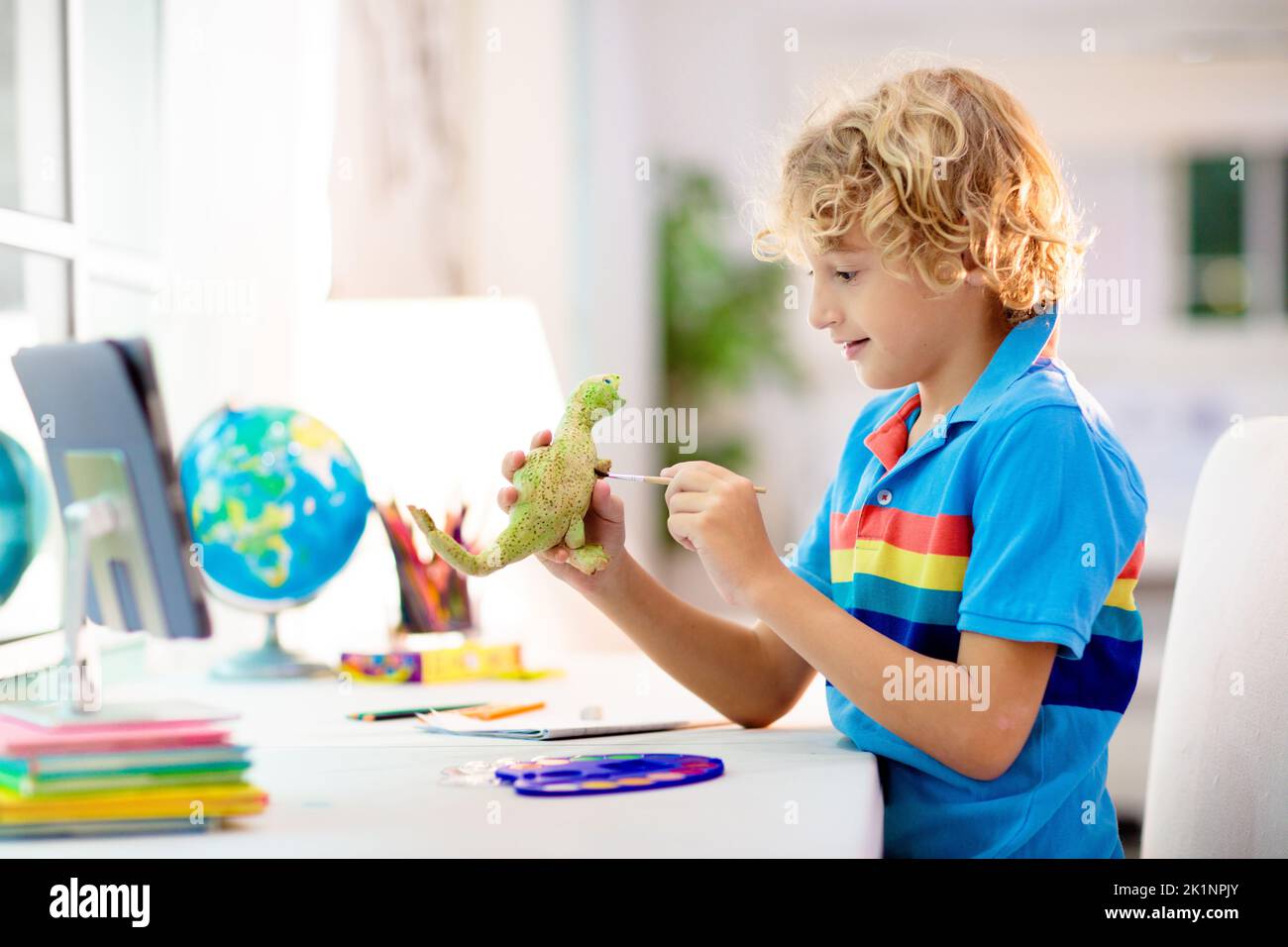 Online remote learning. School kids with computer having video ...
