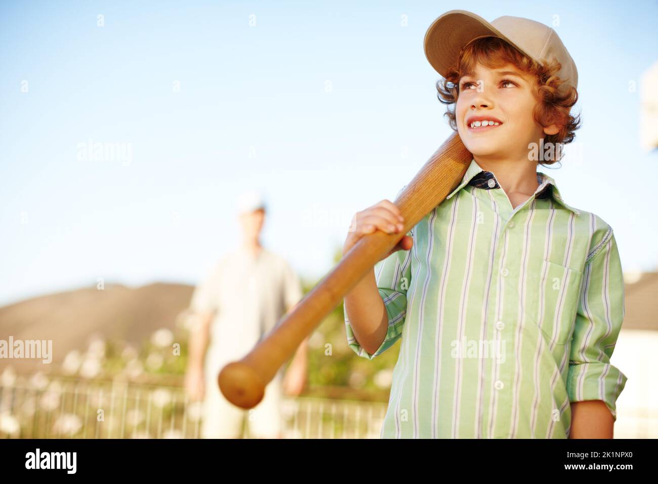 Im gonna be the next big baseball star. a young boy playing baseball in ...