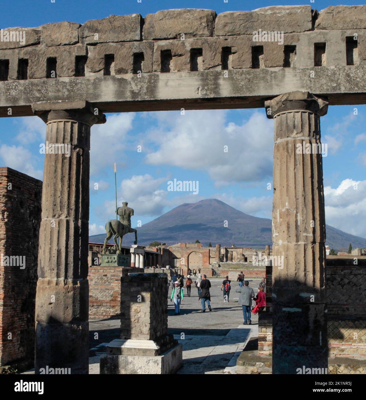 Mount vesuvius looms over the archaeological park / town of Pompeii, a ...