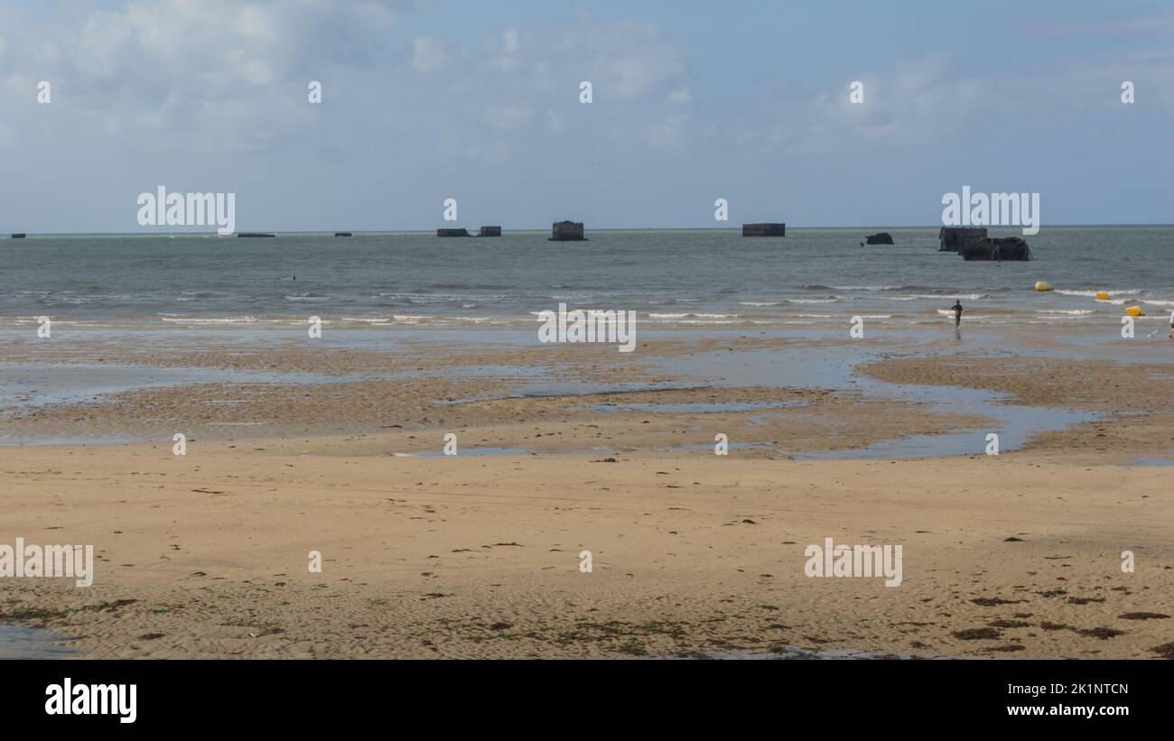 The ruins of artificial port of Gold beach on sunny summer day in ...
