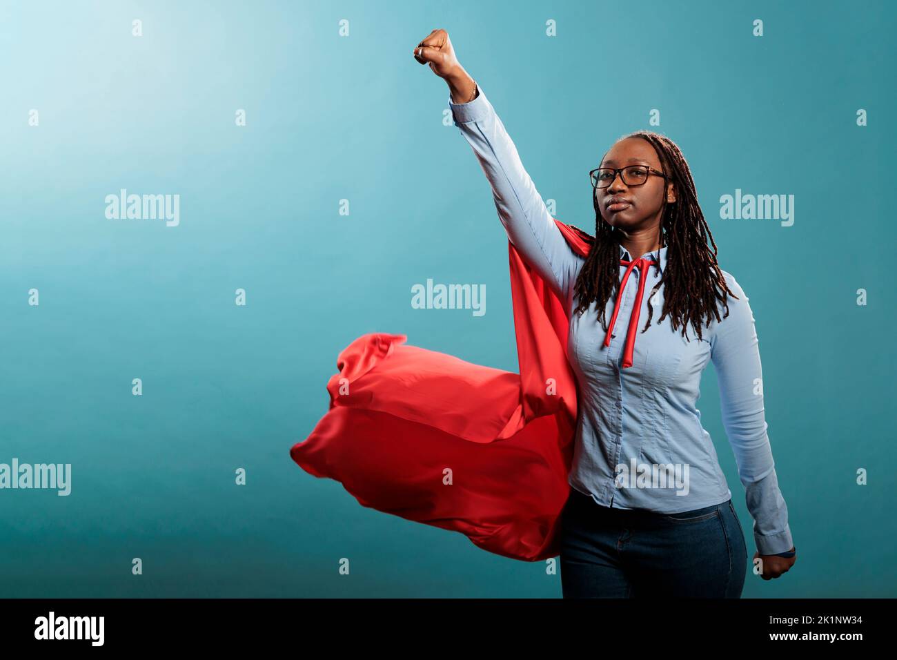 Mighty and brave african american superhero woman posing as justice ...
