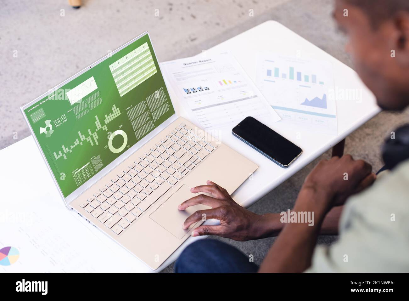African american male entrepreneur analyzing infographic data over ...