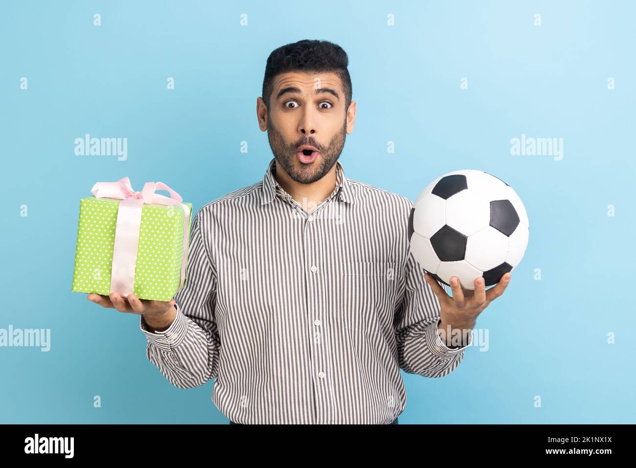 Portrait of shocked surprised businessman standing looking at camera ...