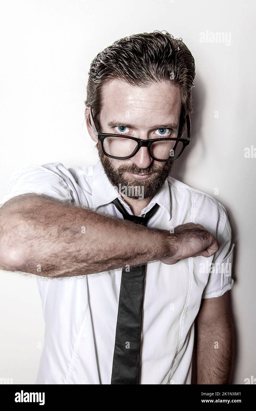 Caucasian blond-haired man with glasses, wearing a white shirt looking ...