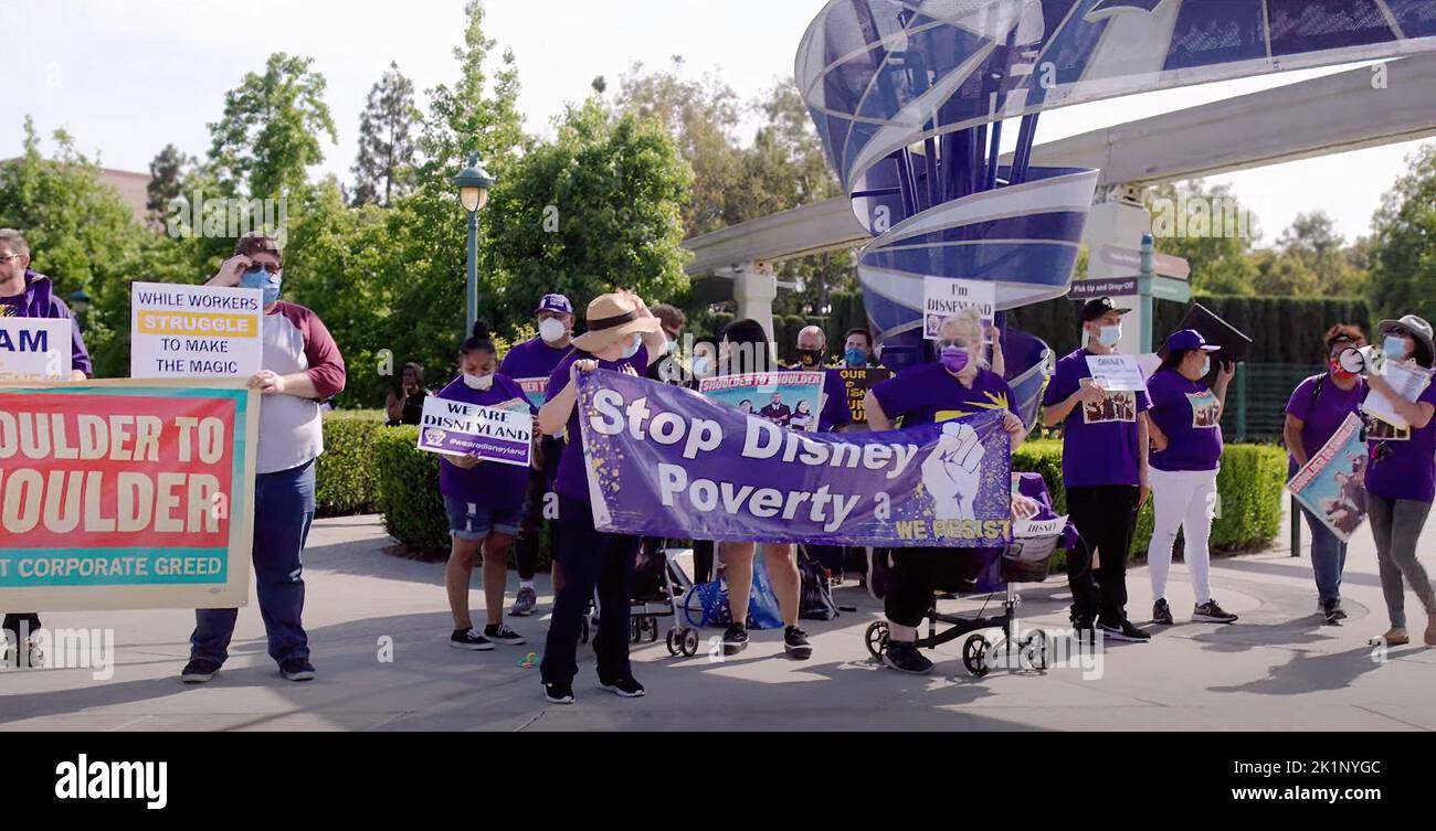 THE AMERICAN DREAM AND OTHER FAIRY TALES, protestors carrying a banner ...