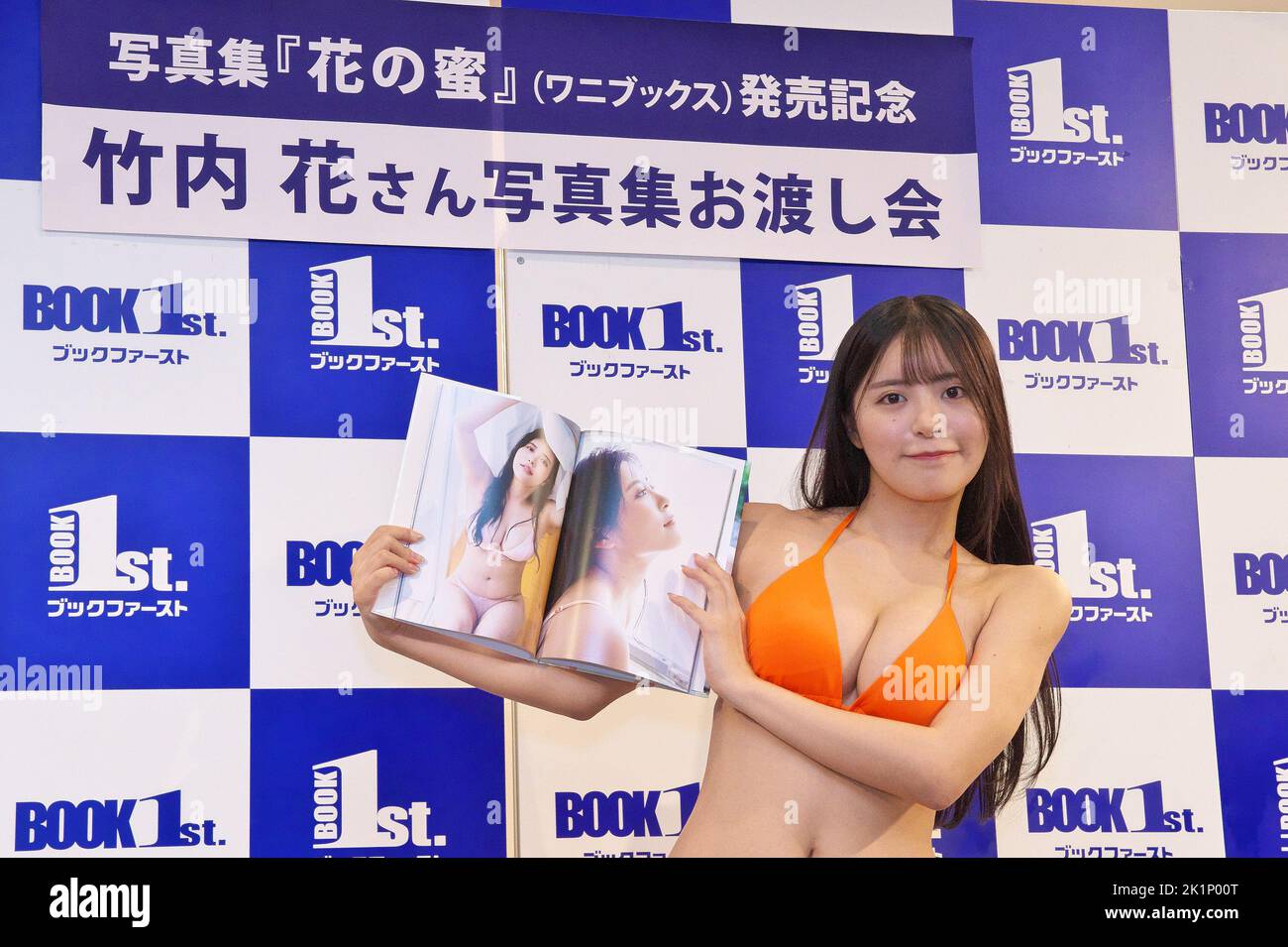 Japanese pin-up model Hana Takeuchi poses for photographers during launch event for her first ...