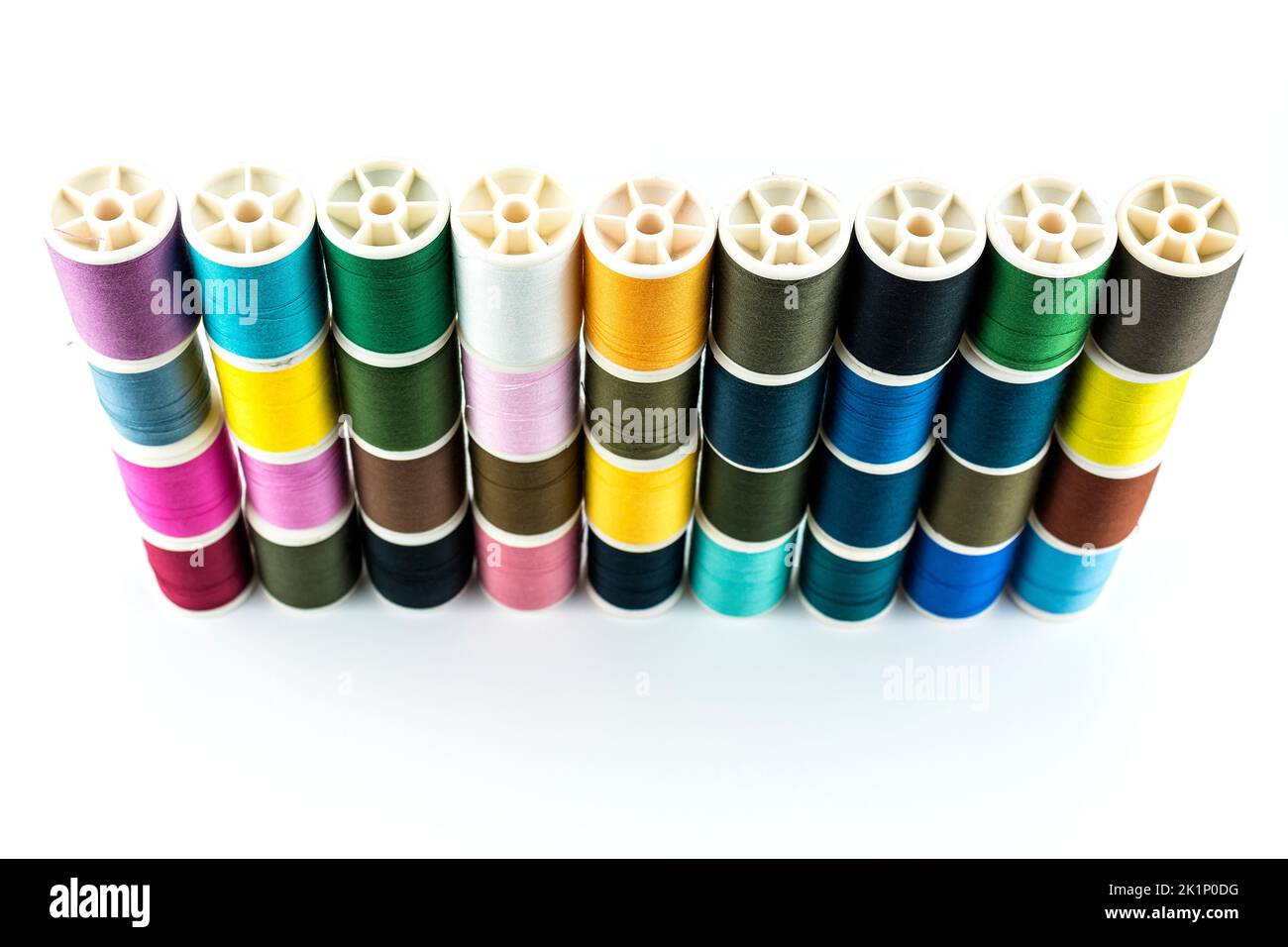 Thread tubes for sewing thread have many colors and are placed on a ...