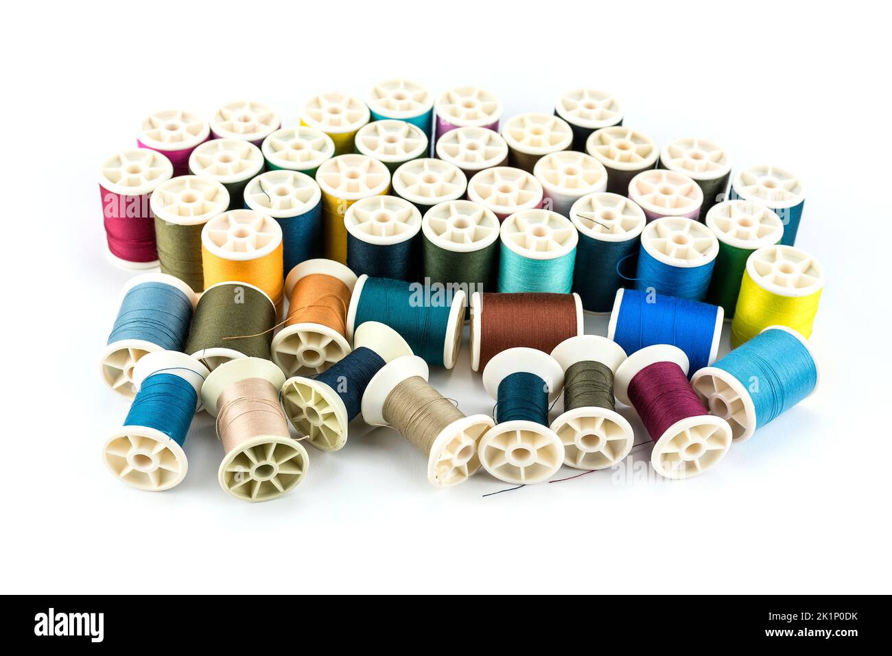 Thread tubes for sewing thread have many colors and are placed on a ...