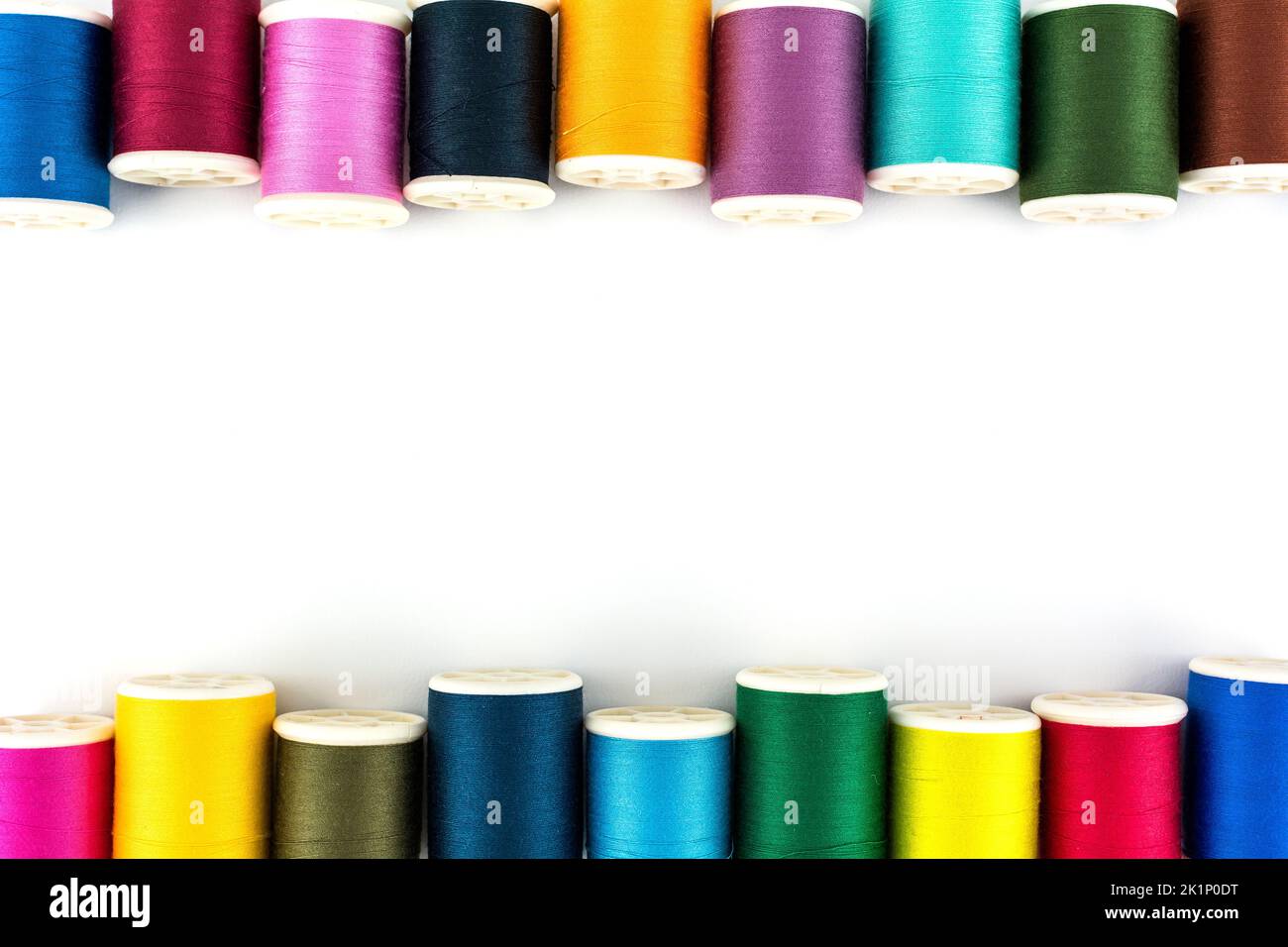 Thread tubes for sewing thread have many colors and are placed on a ...