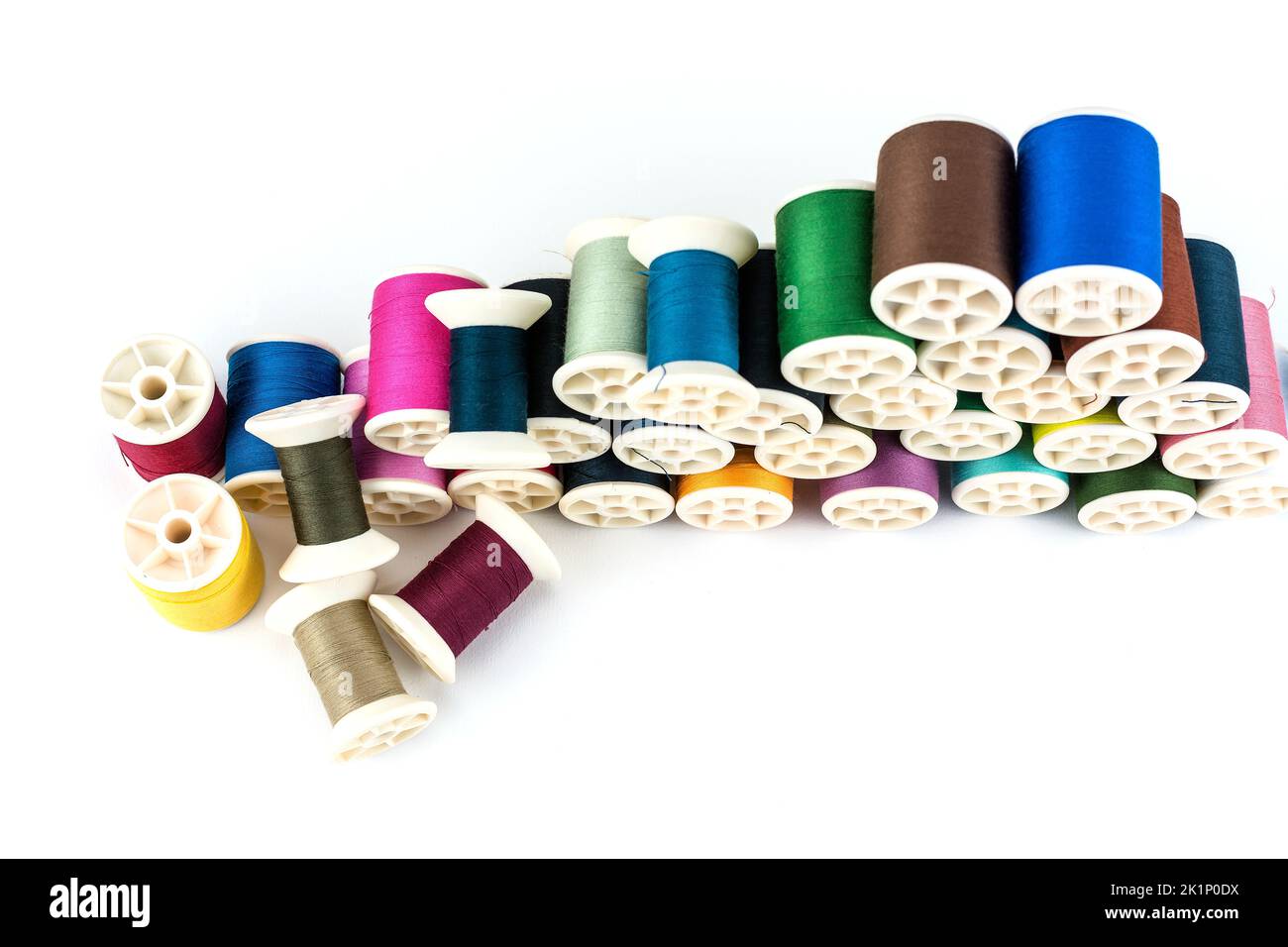 Thread tubes for sewing thread have many colors and are placed on a ...