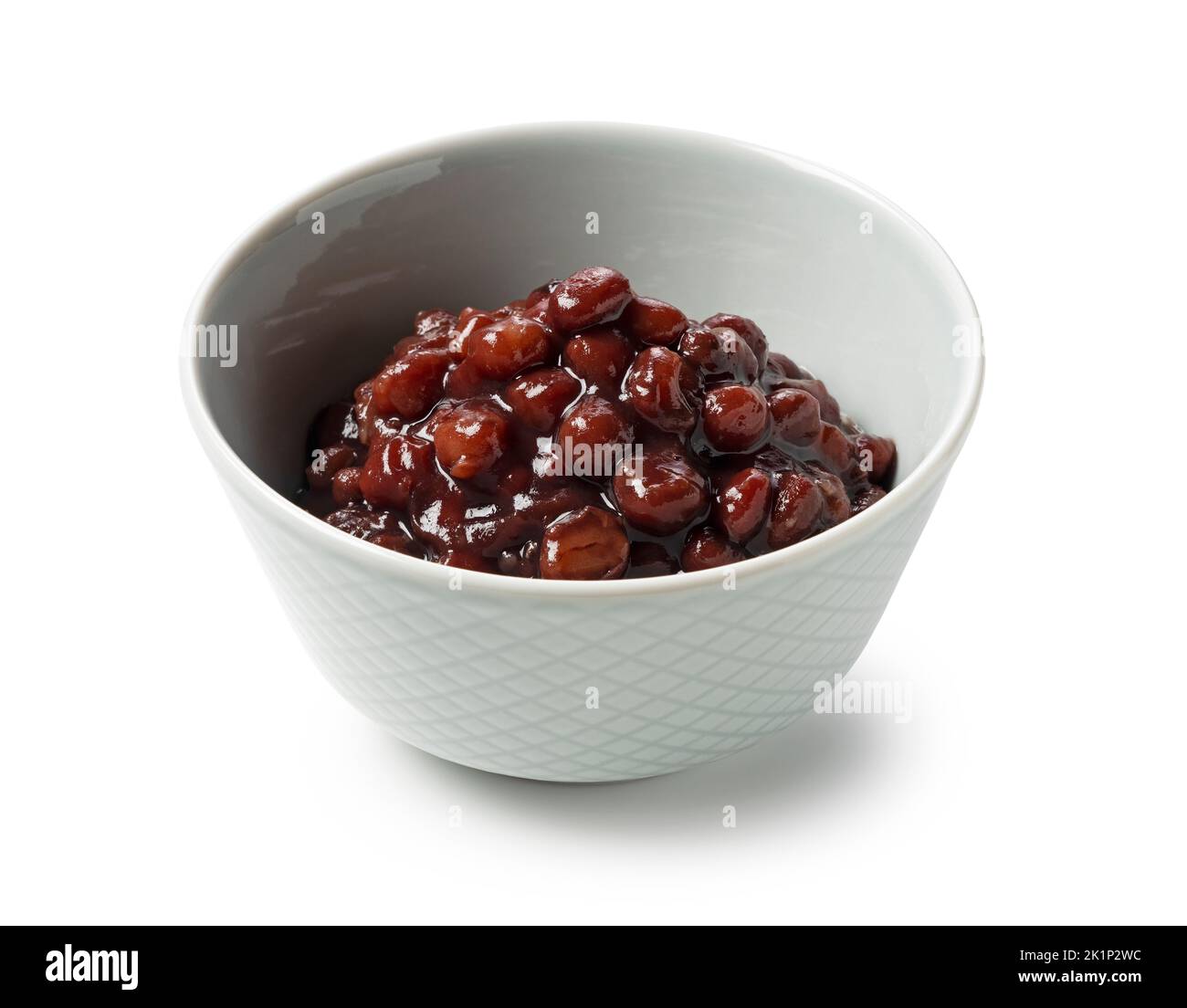 Boiled azuki beans in a small bowl placed against a white background ...