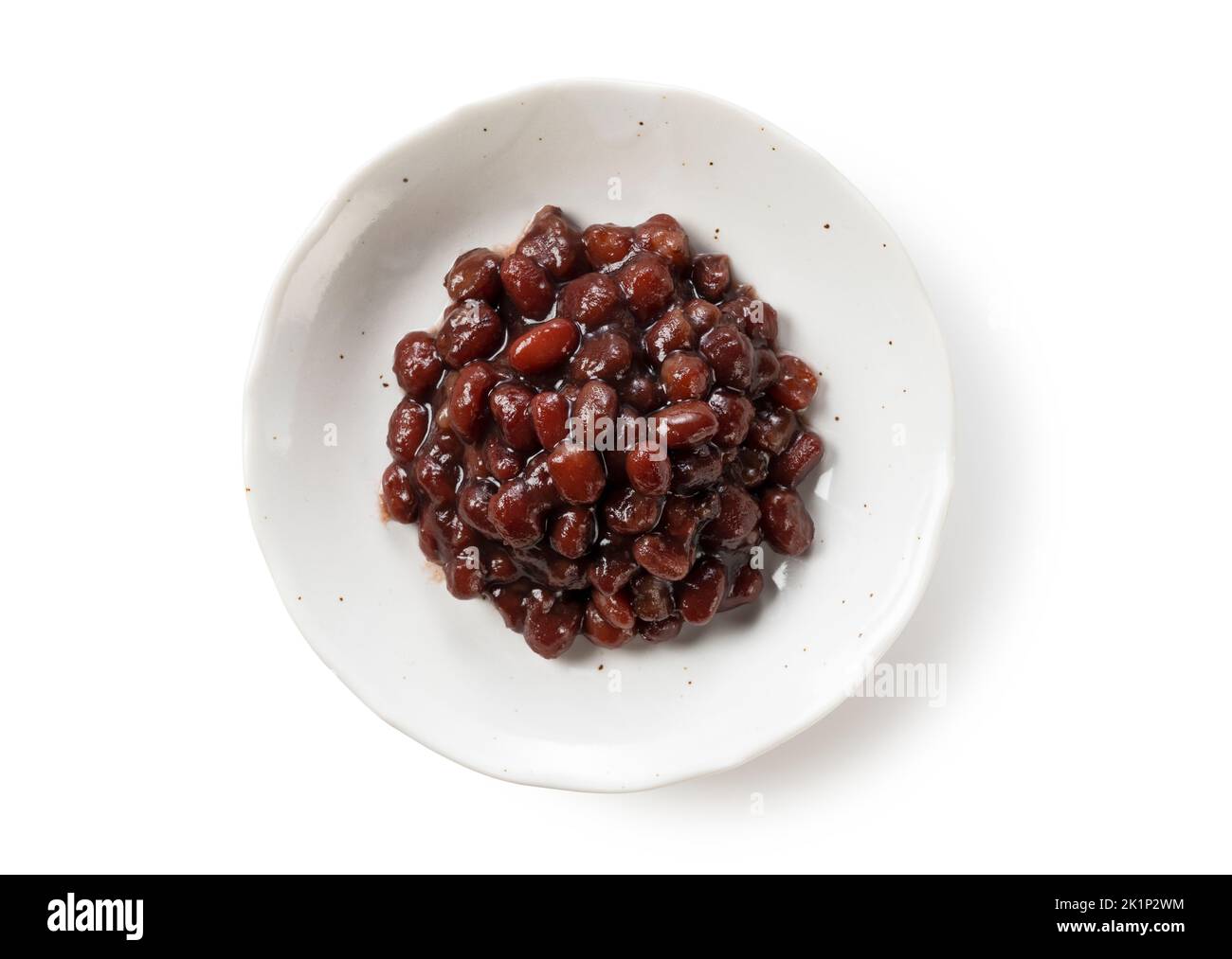 Boiled azuki beans in a dish placed on a white background. View from ...