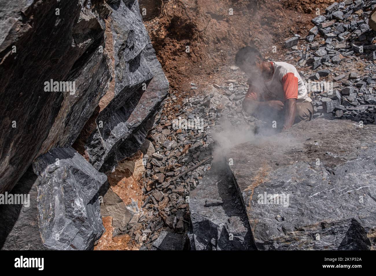 South Konawe, Indonesia. 19th Sep, 2022. A stone miner burns a large ...