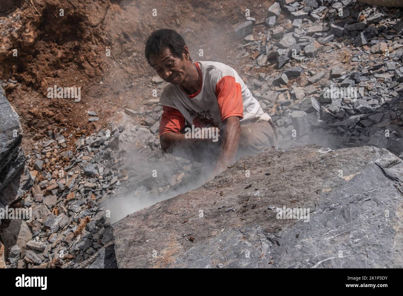 South Konawe, Indonesia. 19th Sep, 2022. A stone miner burns a large ...
