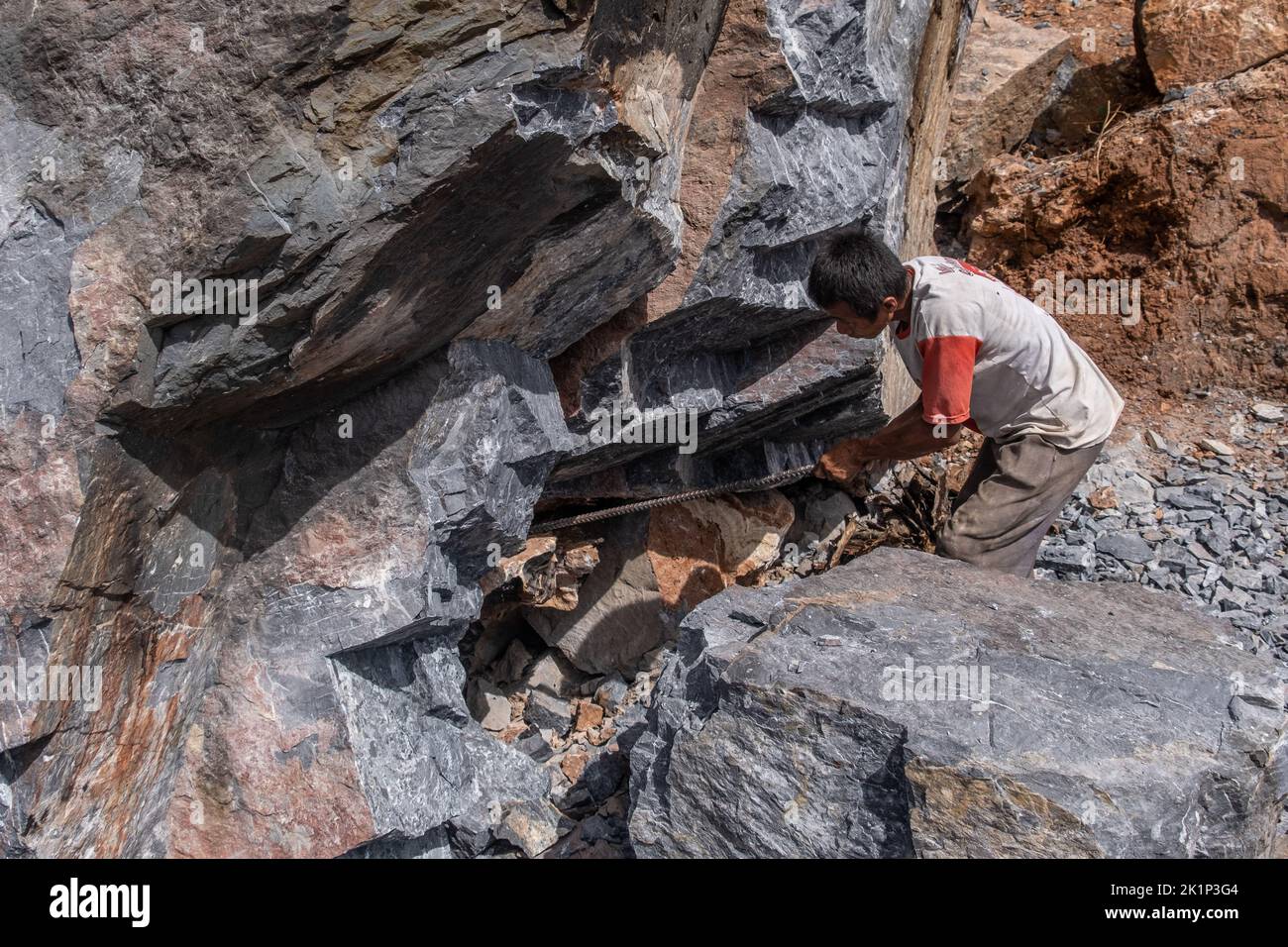 South Konawe, Indonesia. 19th Sep, 2022. A stone miner picks up a stone ...