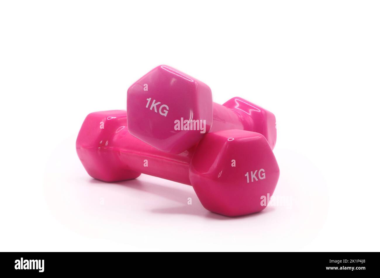 Pink dumbbells with one kilogram weight isolated on white background ...