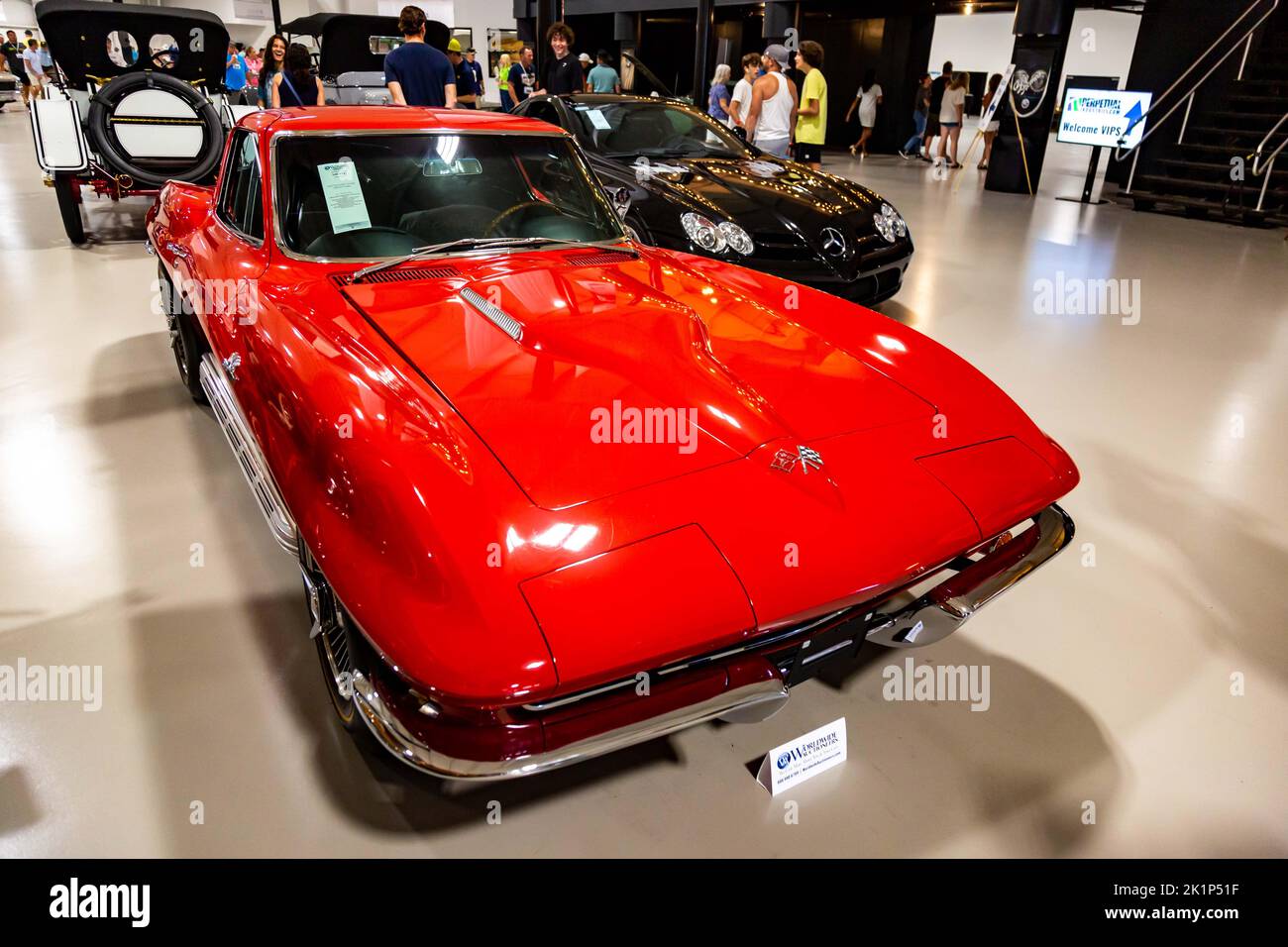 A classic red 1965 Chevrolet Corvette Sting Ray coupe on display at ...