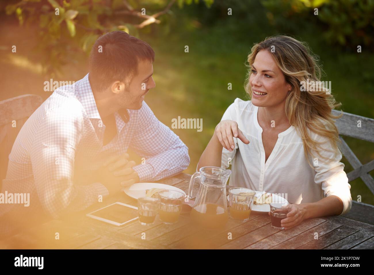 This has been such a perfect day. a happy young couple enjoying dinner outside Stock Photo - Alamy