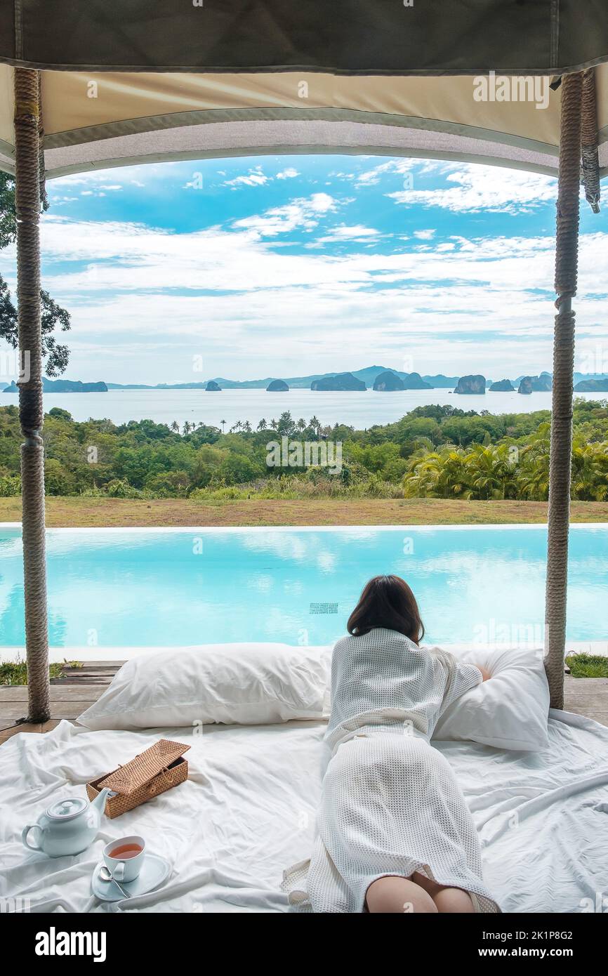 Happy woman traveler enjoy Beautiful ocean view, Tourist relaxing in ...