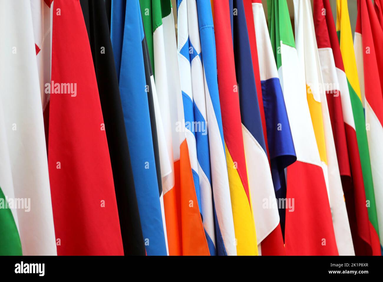 background with many international flags of many nations and different ...