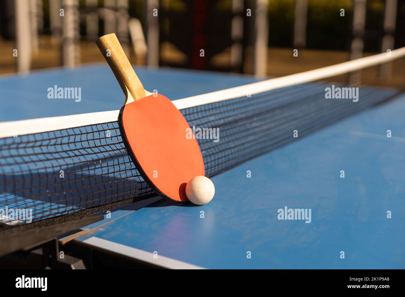 Ping pong table, rackets and balls in a sport hall Stock Photo - Alamy