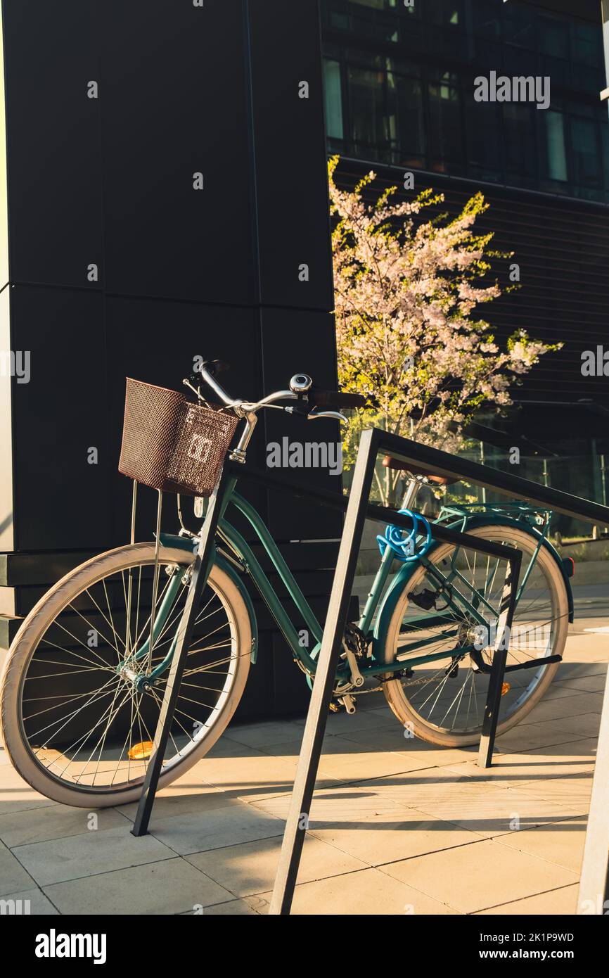 Modern bicycle parked on city street. Business centre district ...
