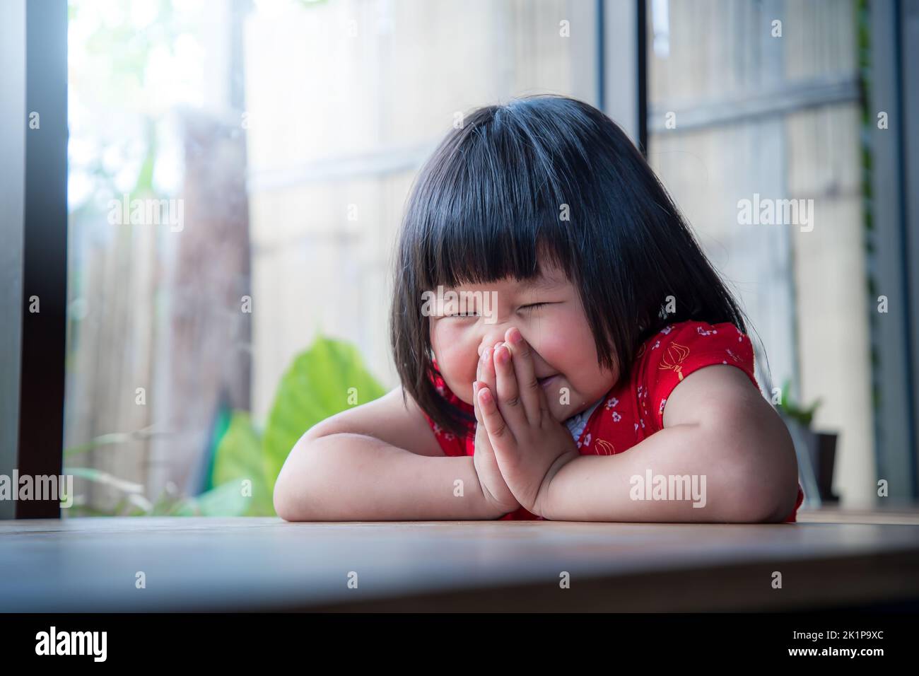 Happy little girl praying at home, child's pure faith Stock Photo - Alamy