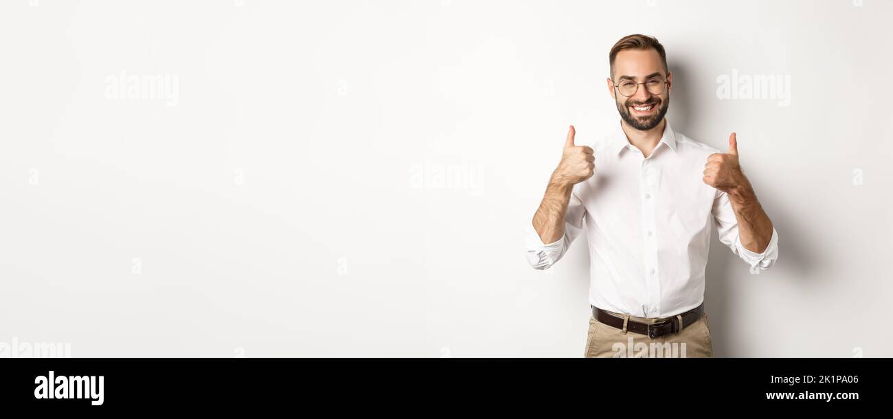 Successful businessman praising good work, showing thumbs up and ...