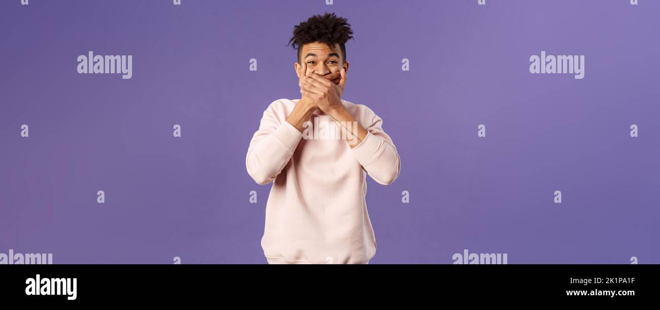 Portrait of amused, funny and carefree male student fooling around ...