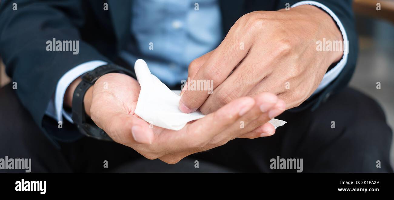 Man clean hand by wet wipe tissue after contract something, protection ...
