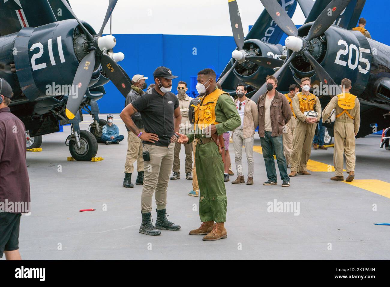 DEVOTION, from left: director J.D. Dillard, Jonathan Majors, on set ...