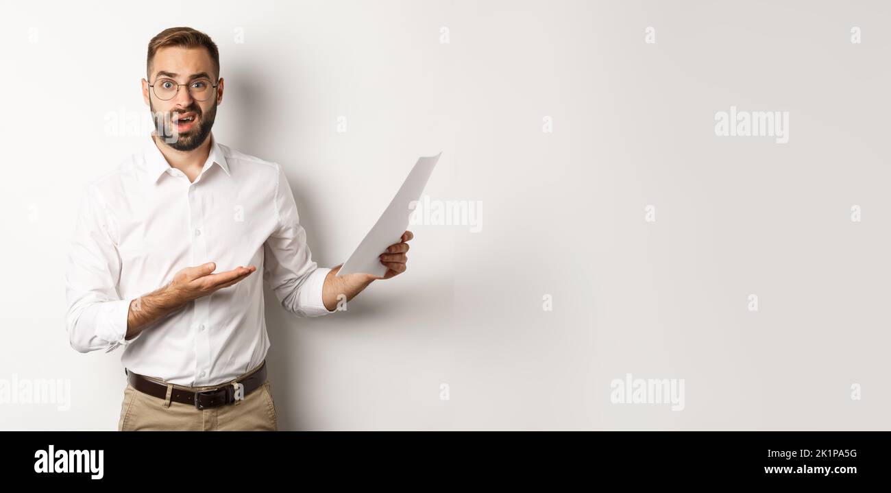Confused businessman reading documents hi-res stock photography and ...